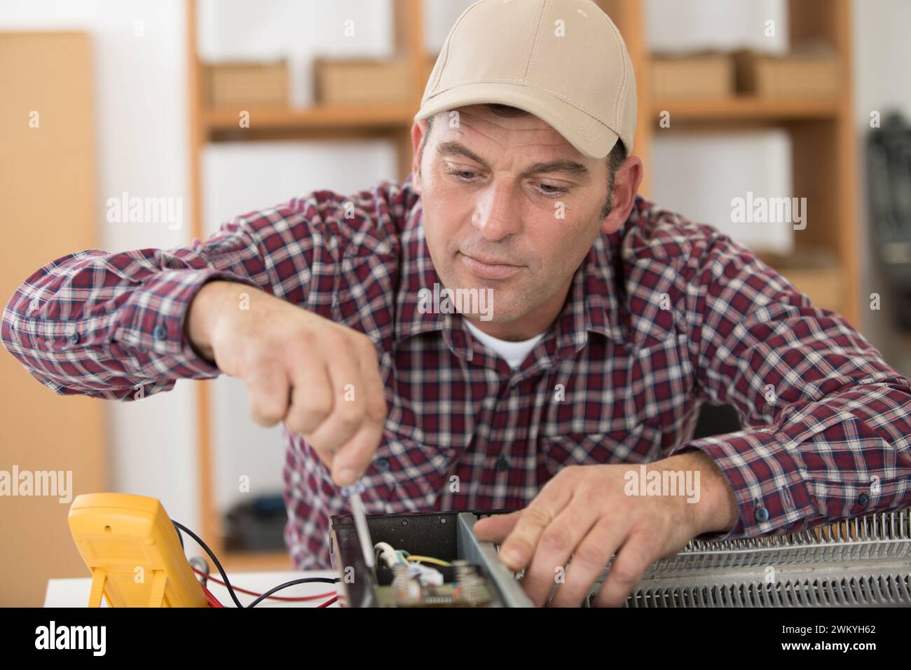 a man fixing radiator parts Stock Photo - Alamy