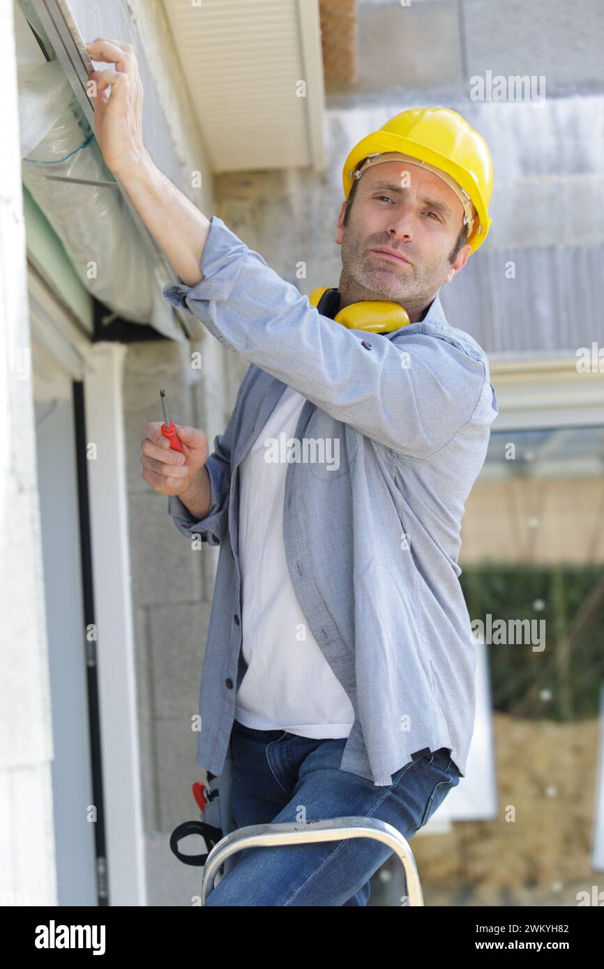 Installing shutters hi-res stock photography and images - Alamy