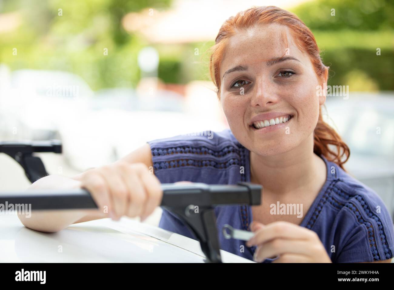woman install roof bar or rail on her car Stock Photo - Alamy woman install roof bar or rail on her car Stock Photo - Alamy