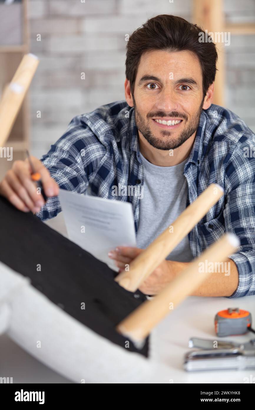 Man repairing sofa hi-res stock photography and images - Alamy
