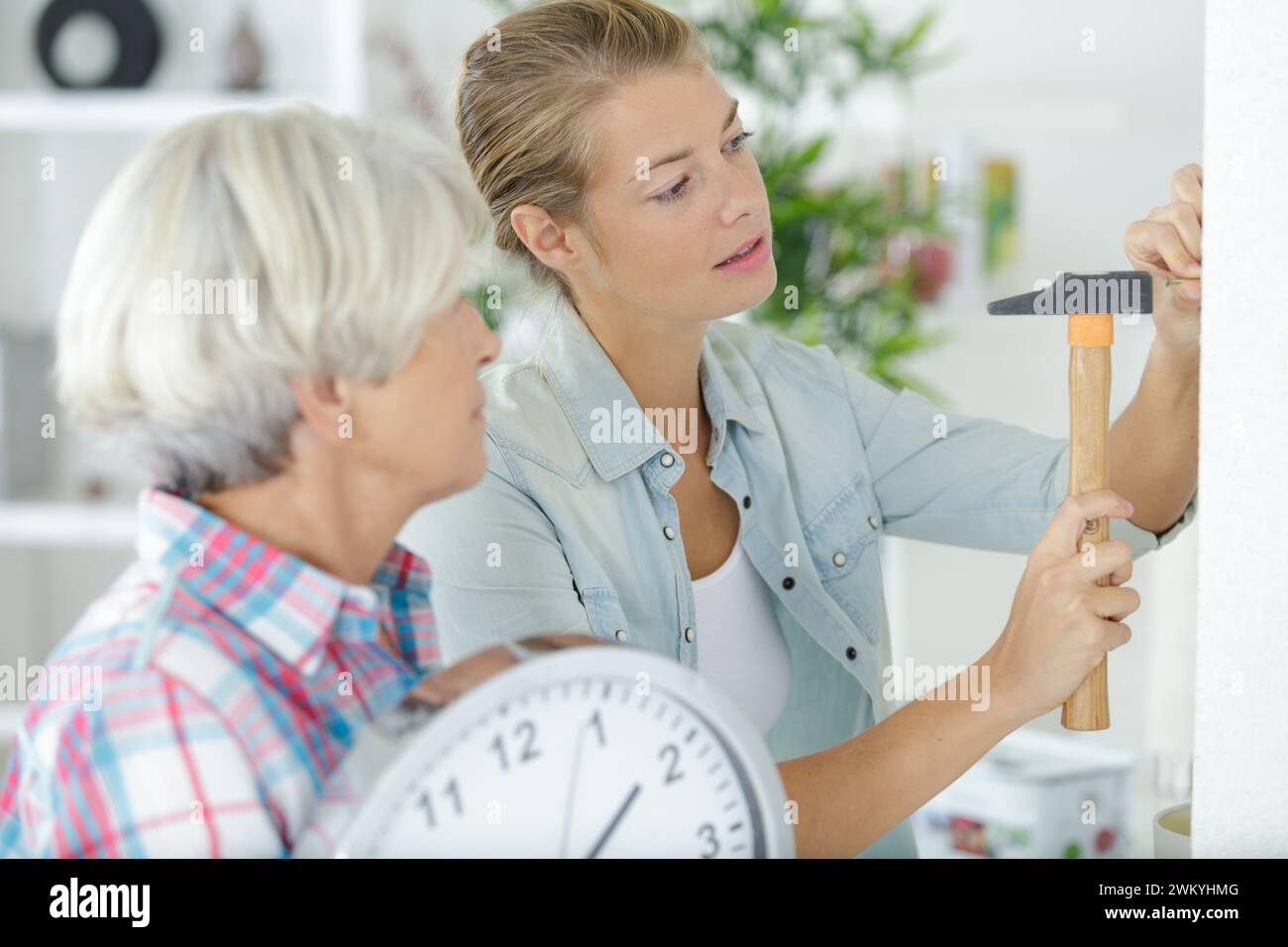 smiling family makes repairs at home Stock Photo - Alamy