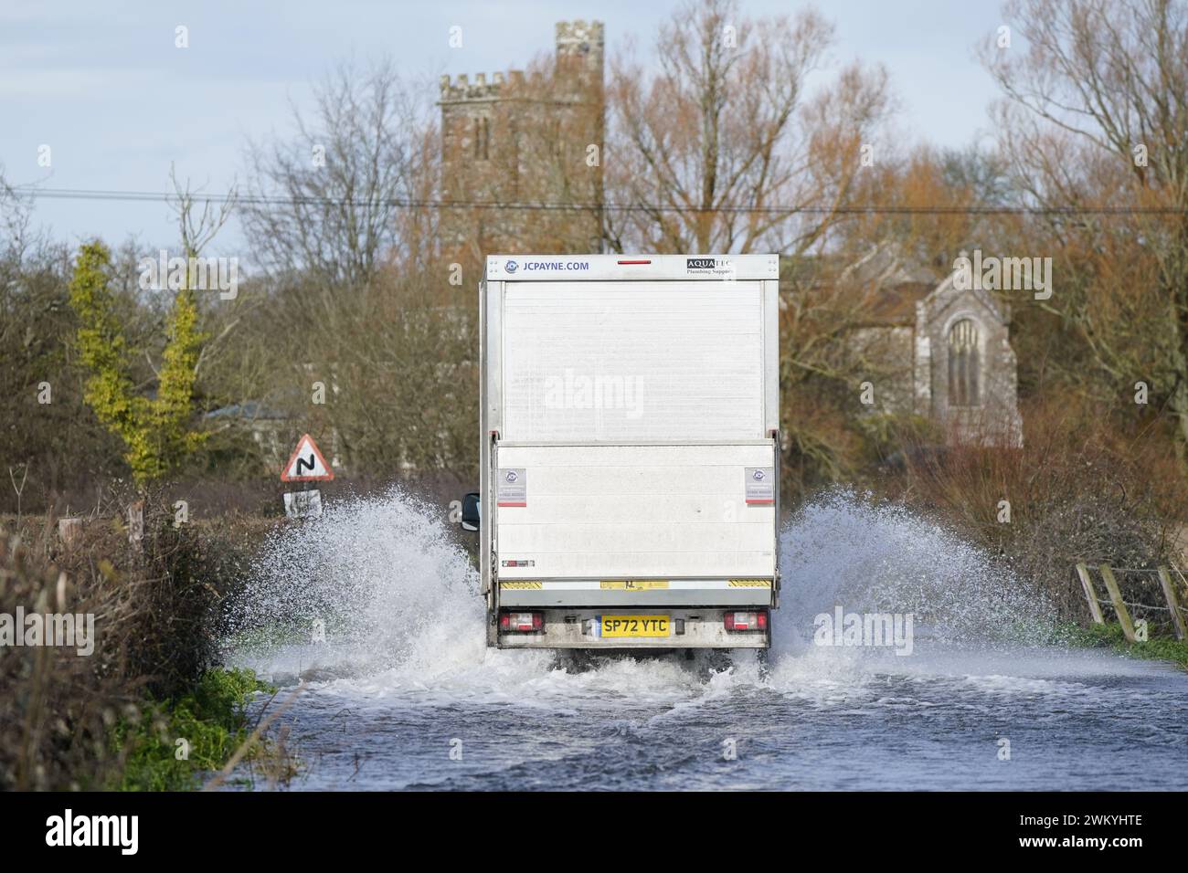 A van is driven through floodwater in Harbridge, Hampshire. Schools ...