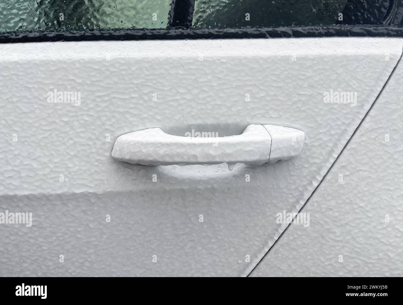 Car door handle covered in ice Stock Photo - Alamy