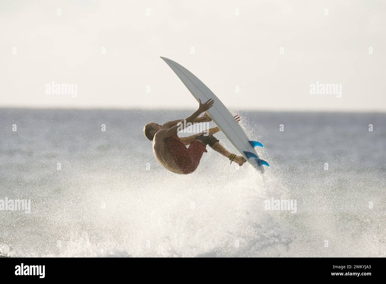Surfer flying off wave, Oahu Stock Photo - Alamy