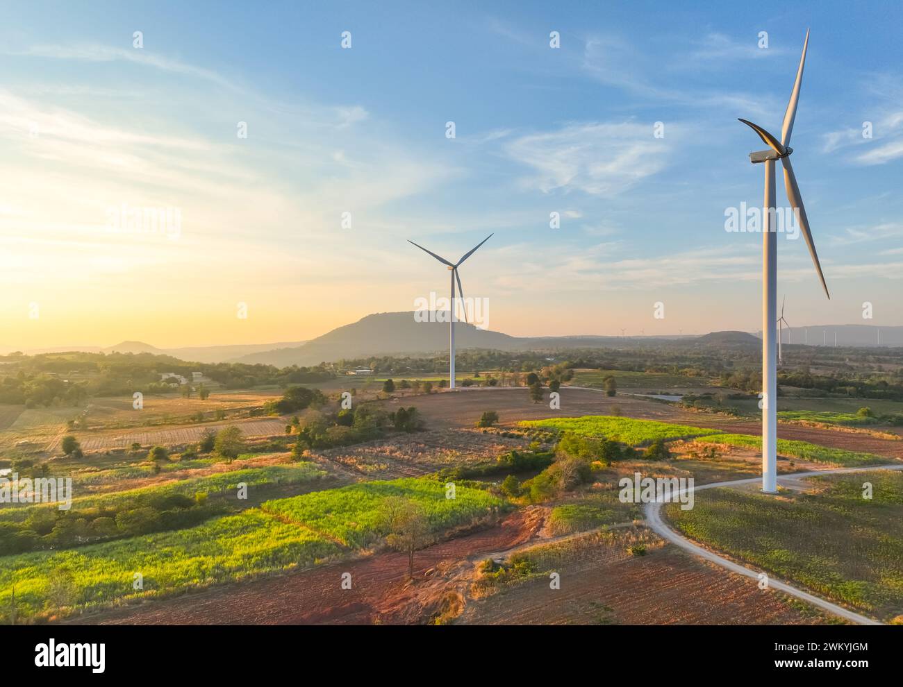 Wind farm field and sunset sky. Wind power. Sustainable, renewable ...