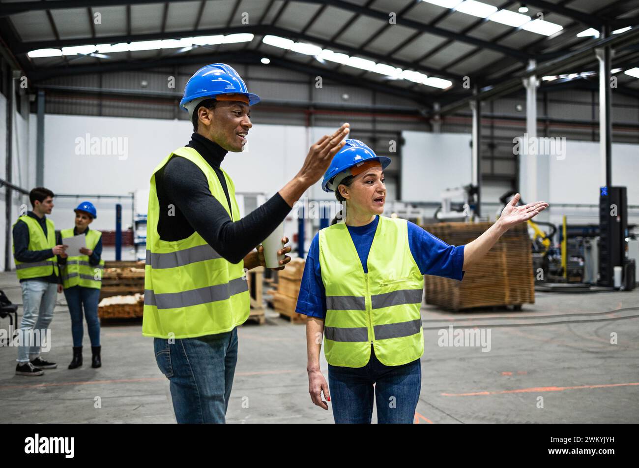 Team of engineers working in robotic factory - Automation industry ...