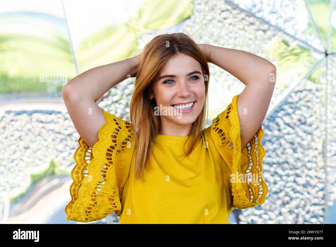 Woman in yellow top hi-res stock photography and images - Alamy