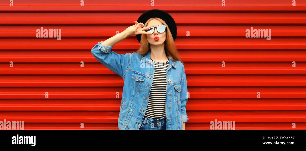 Portrait of stylish young woman model blowing her lips sending sweet ...