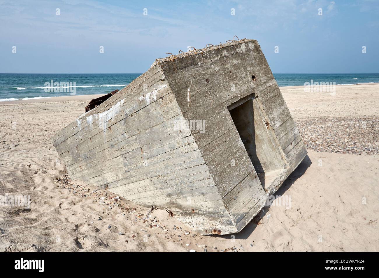 German WWII bunker partly buried in sand at Noerlev Beach on the west ...