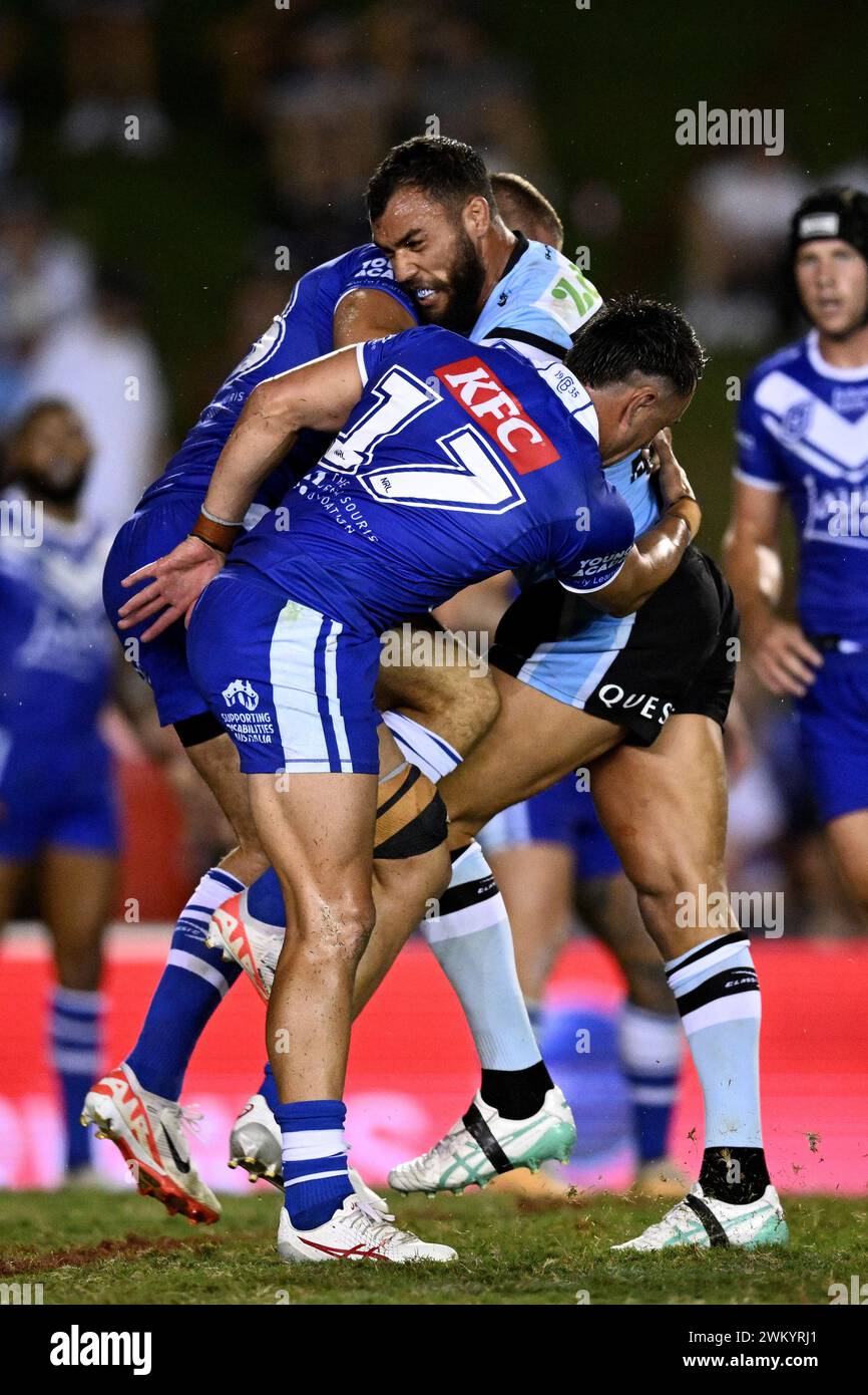Sydney, Australia. 23rd Feb, 2024. Toby Rudolf of the Sharks is tackled ...
