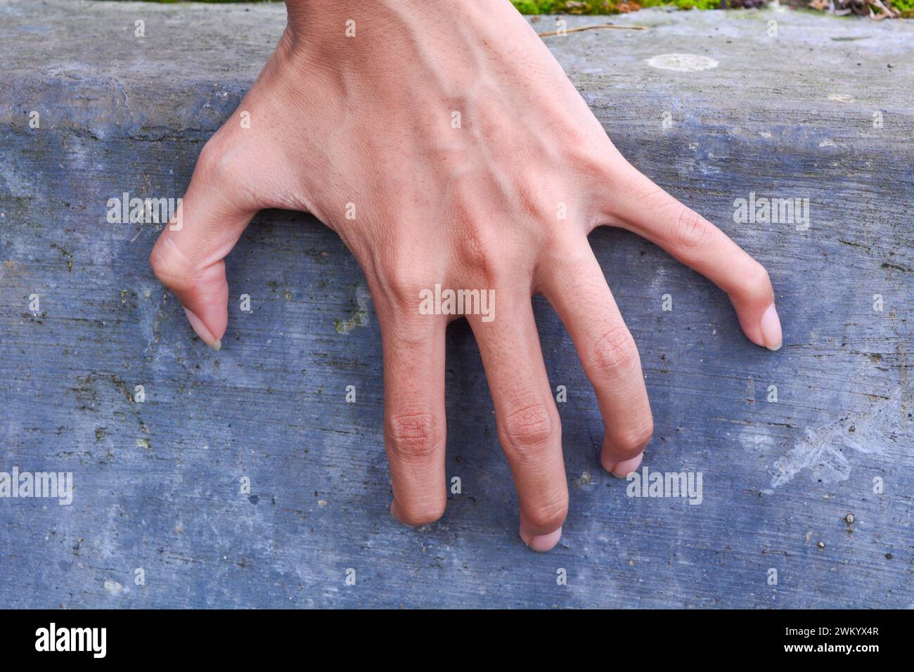 Open hand with horror Gesture impression isolated on rocks background ...