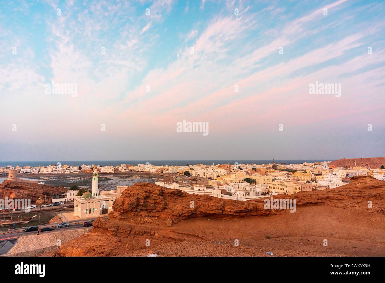 West part of Sur town with Al-Ayjah Castle, mosque in golden hour, Oman ...
