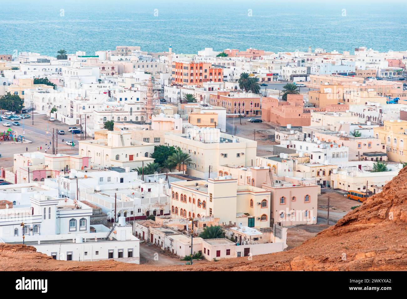 Residential and city buildings in Sur, Oman., Golden hour, view from ...