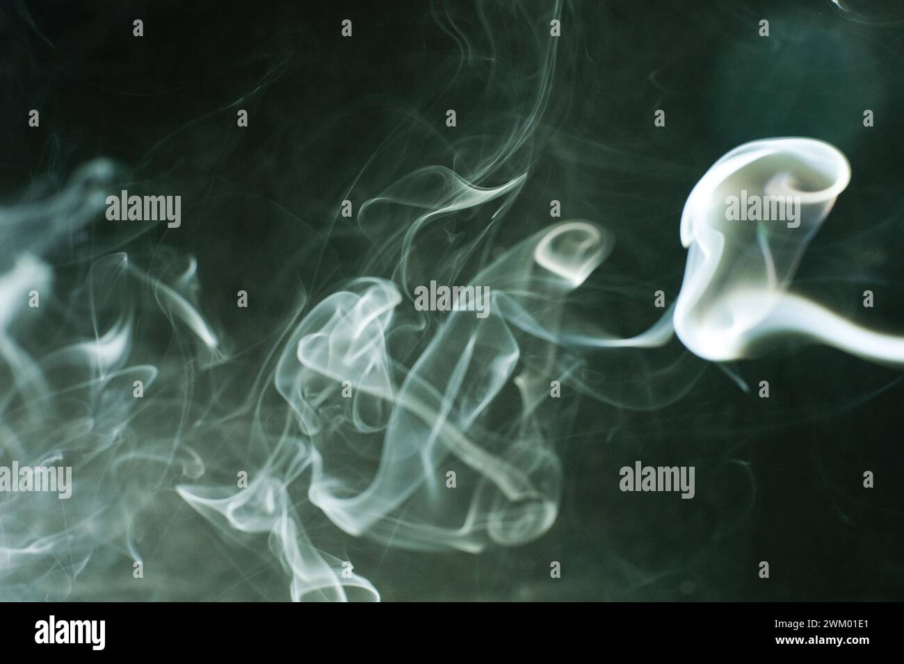 a misty smoky effect background with swirls of defuse smoke vapour ...