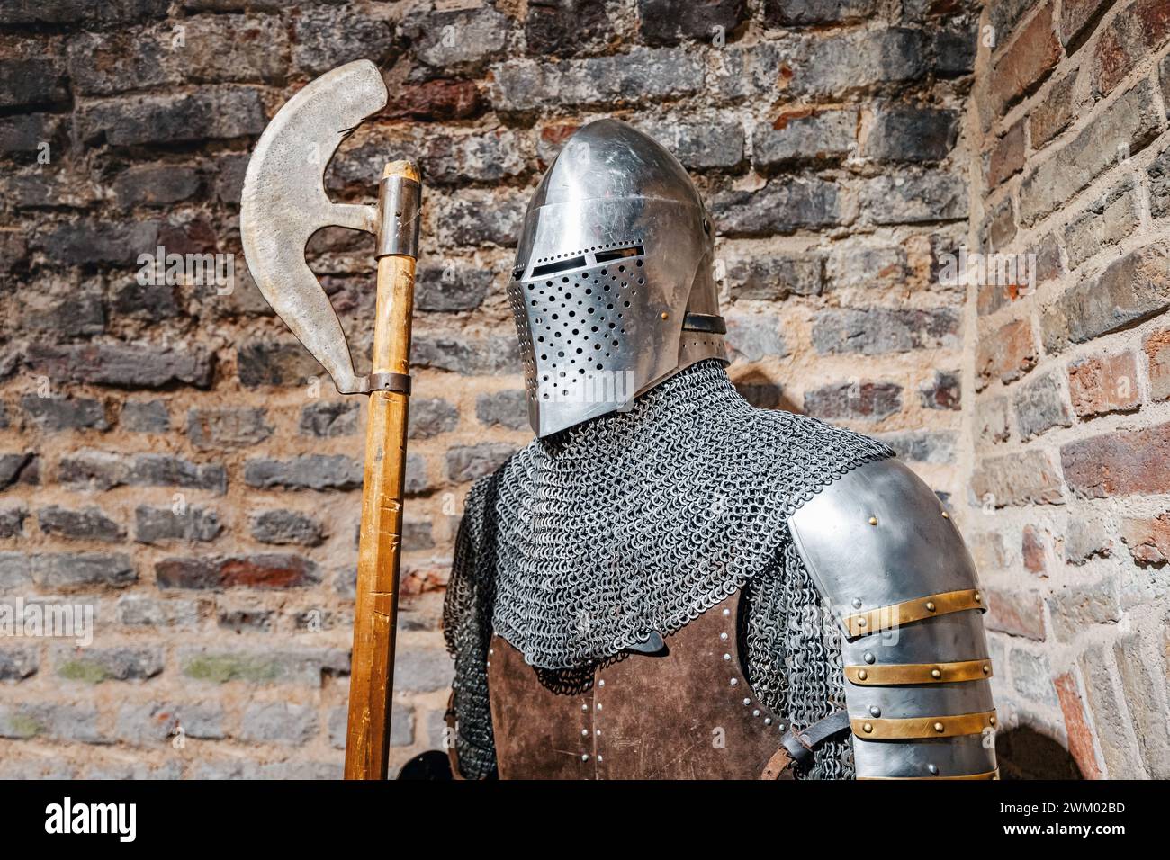 Medieval knight in full armor with weapon in fortress Stock Photo - Alamy