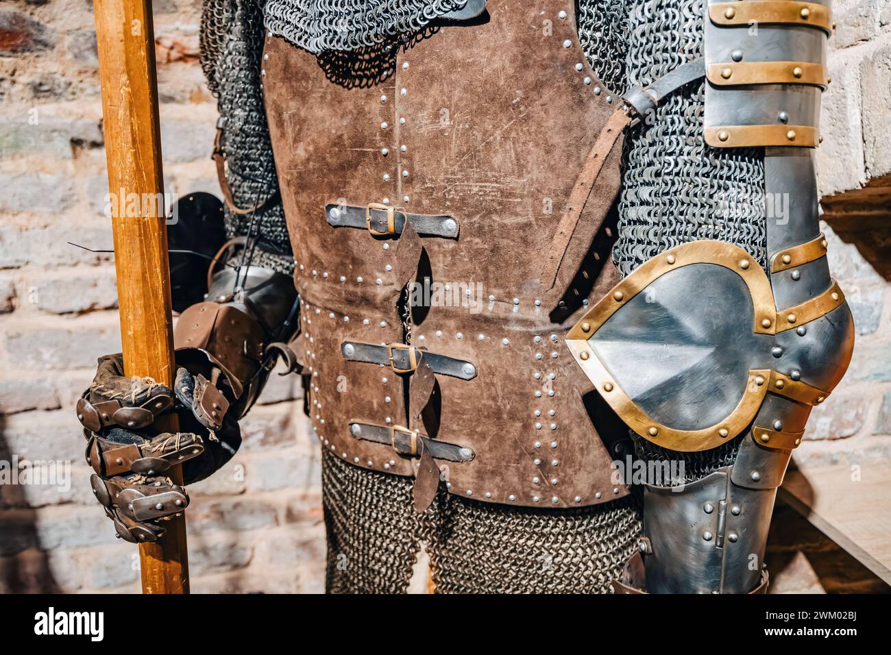 Medieval knight in full armor with weapon in fortress Stock Photo - Alamy