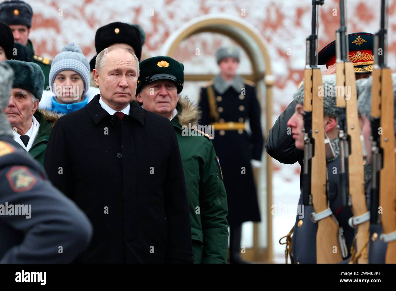 Russian President Vladimir Putin takes part in a wreath laying ceremony ...
