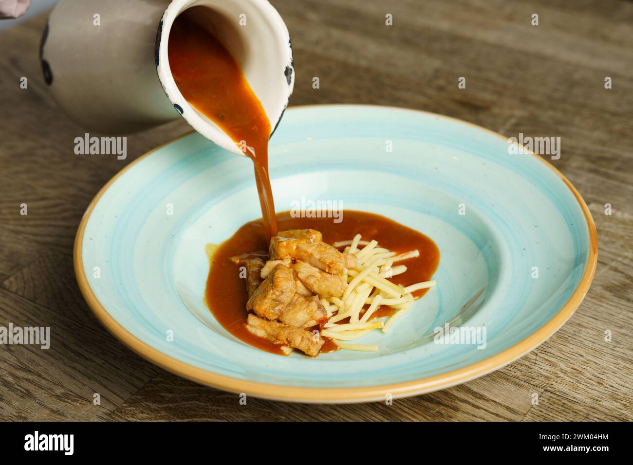 Hungarian fish soup with catfish Stock Photo - Alamy