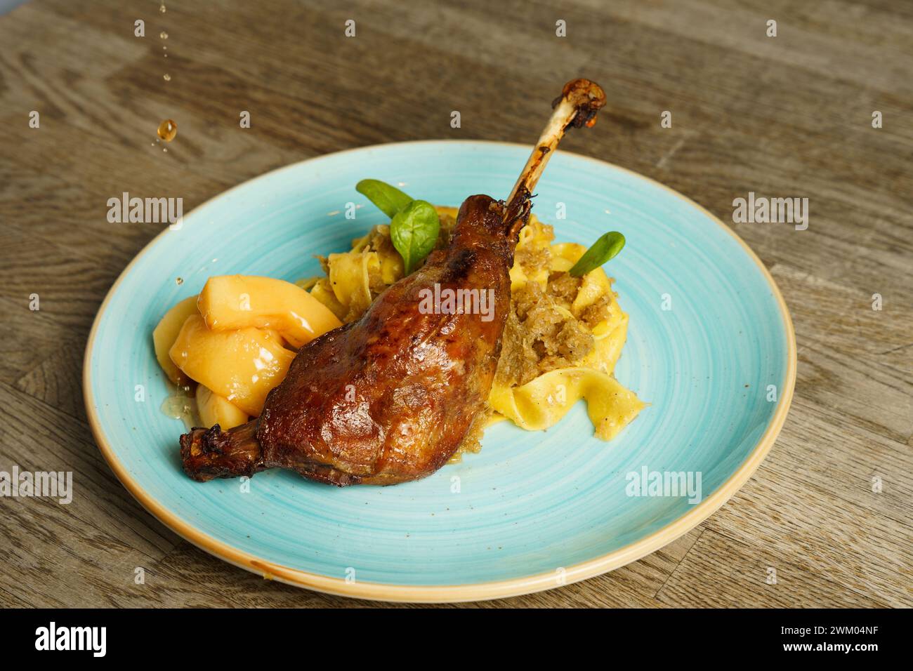 Roasted goose leg with cabbage papardelle pasta and quince compote ...