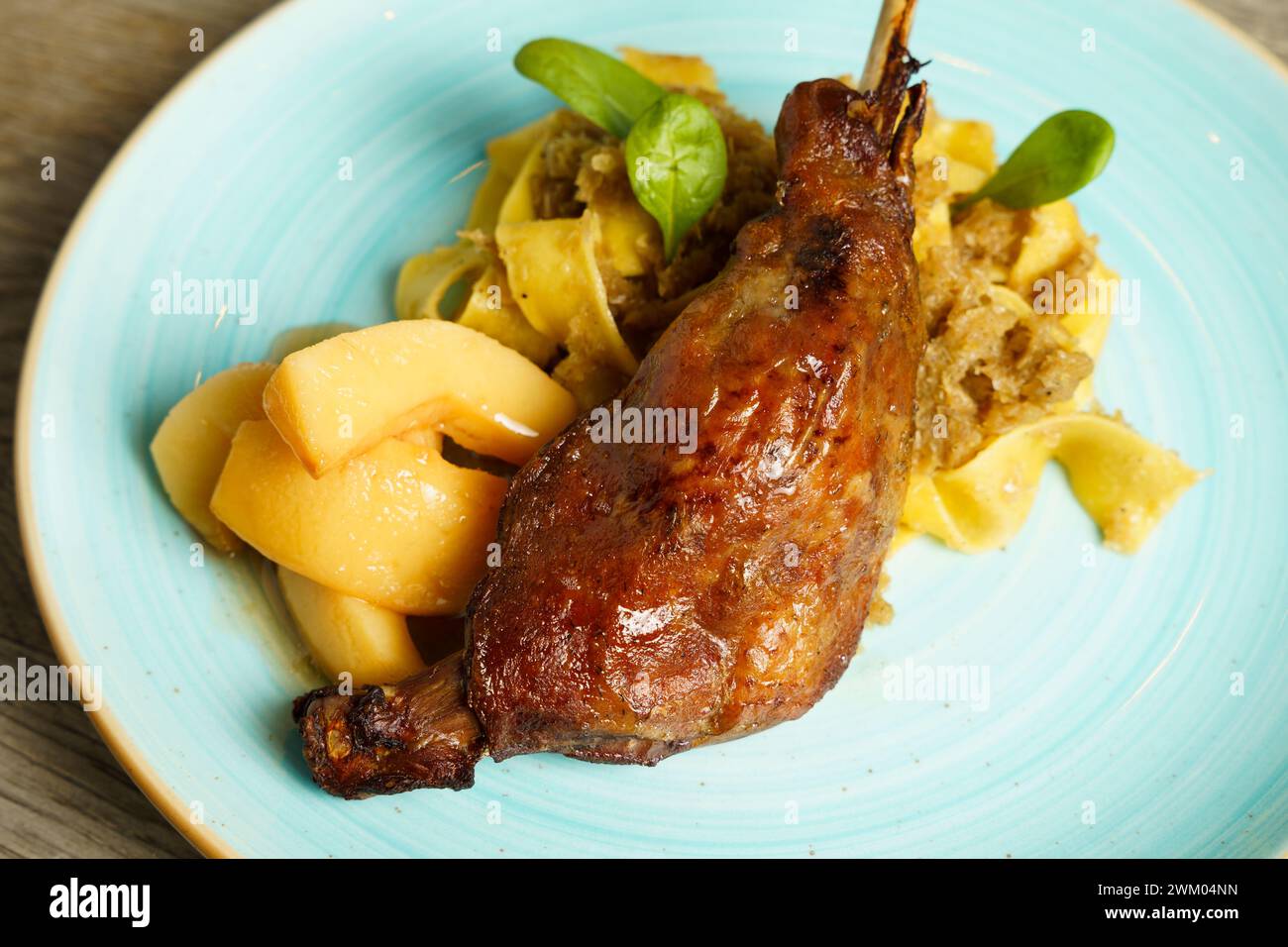 Roasted goose leg with cabbage papardelle pasta and quince compote ...