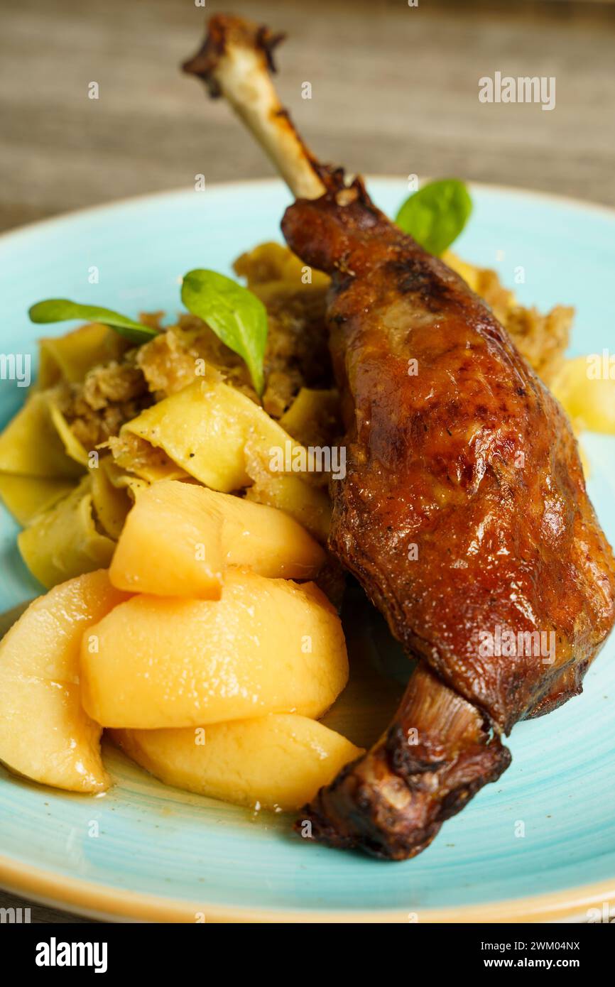 Roasted goose leg with cabbage papardelle pasta and quince compote ...