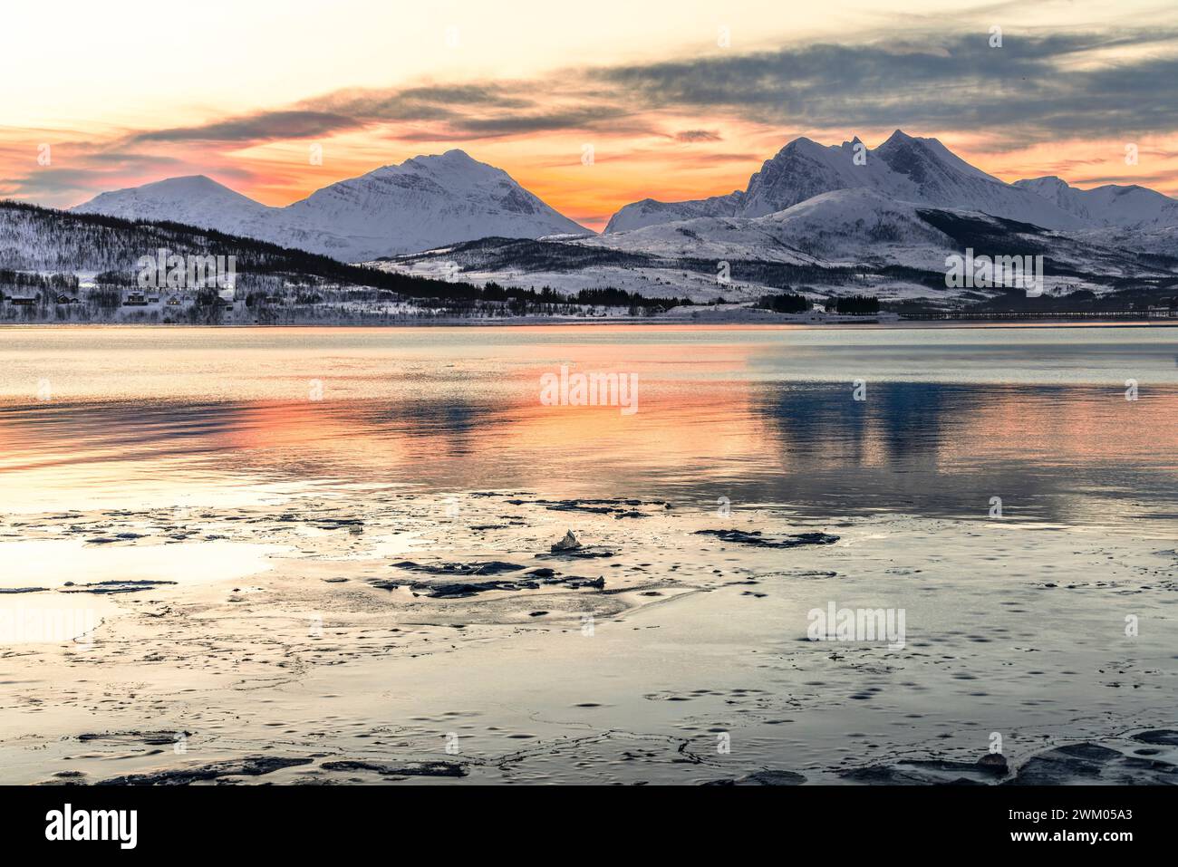 Landscape amidst fjiords and sharp Alpine mountains, the sun is not ...