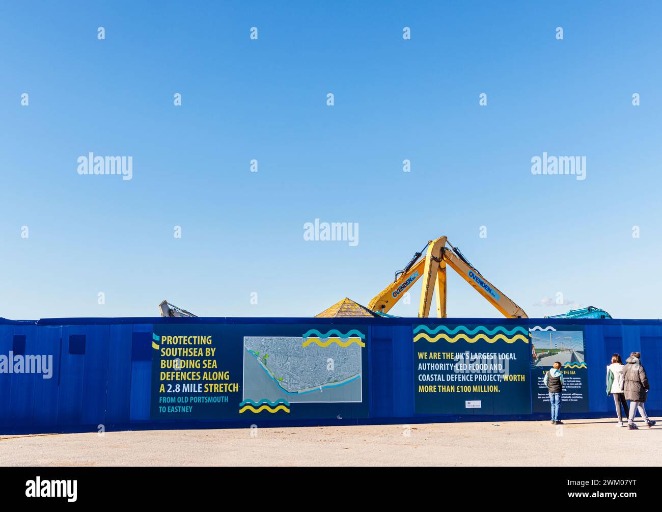 Sign with details and information about a new coastal defence project ...