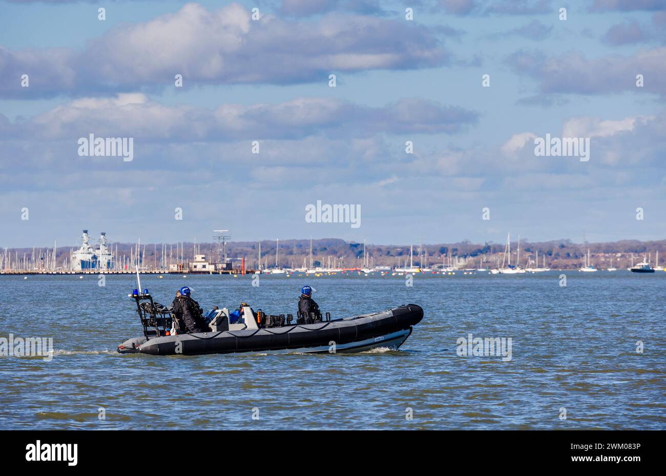 Occupations: a Police RIB inflatable boat afloat, sailing in Portsmouth ...