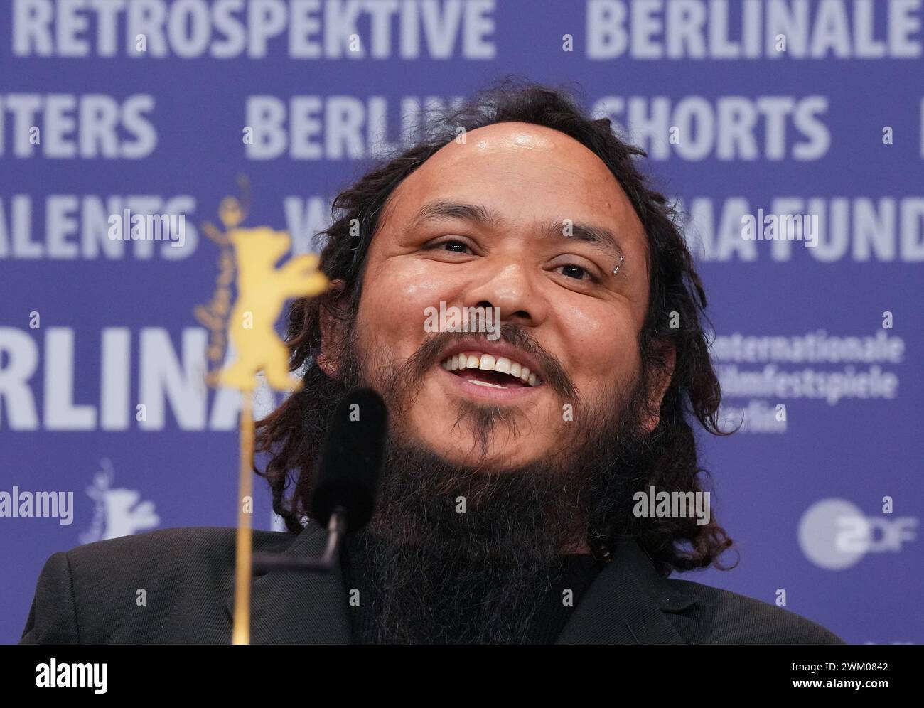 23 February 2024, Berlin: Director Min Bahadur Bham laughs during the ...