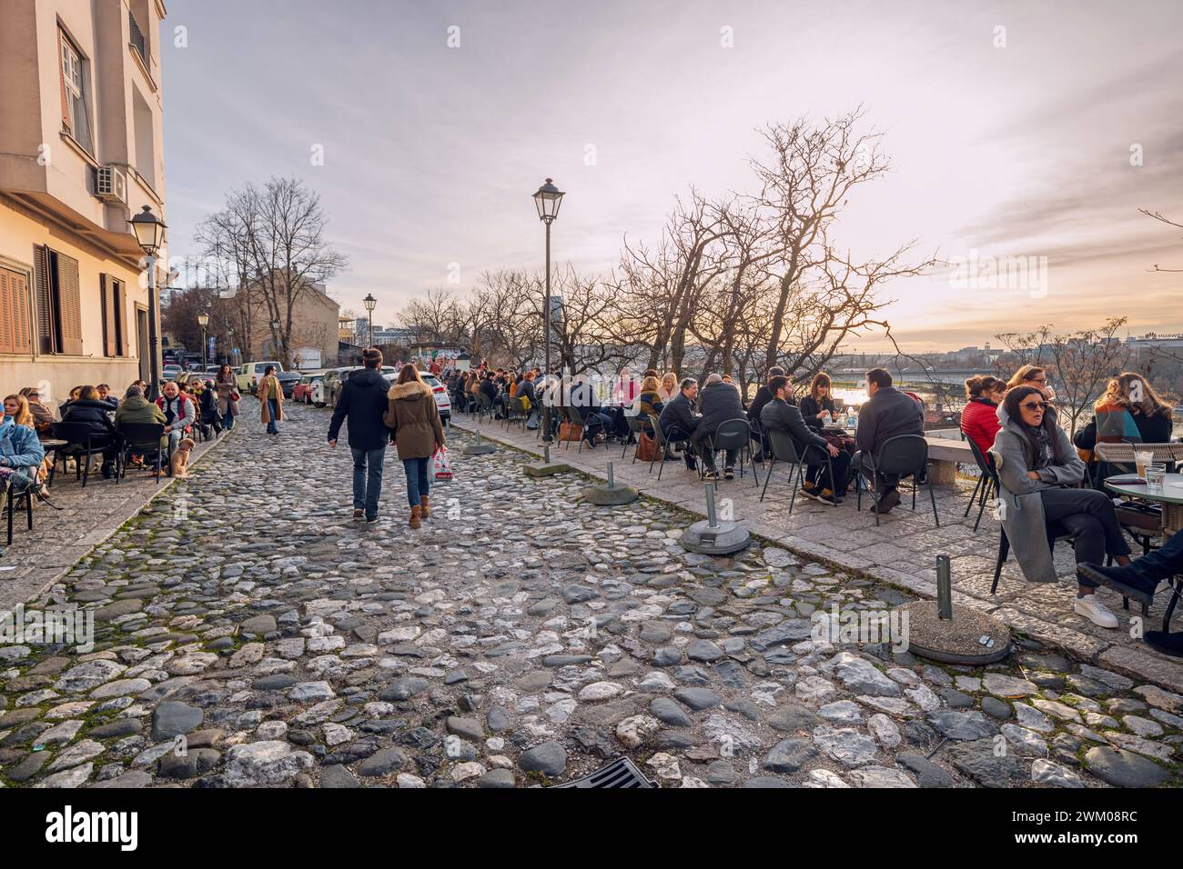 02 January 2024, Belgrade, Serbia: people resting in open cafe with ...
