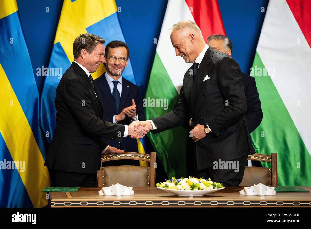 Budapest, Hungary. 23rd Feb, 2024. Göran Martensson (l), Director General of the Swedish Defense ...