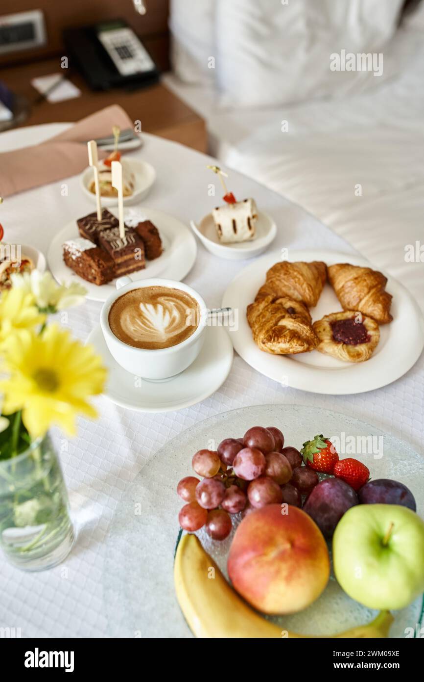 Hotel room service with fresh cappuccino and a variety of breakfast ...