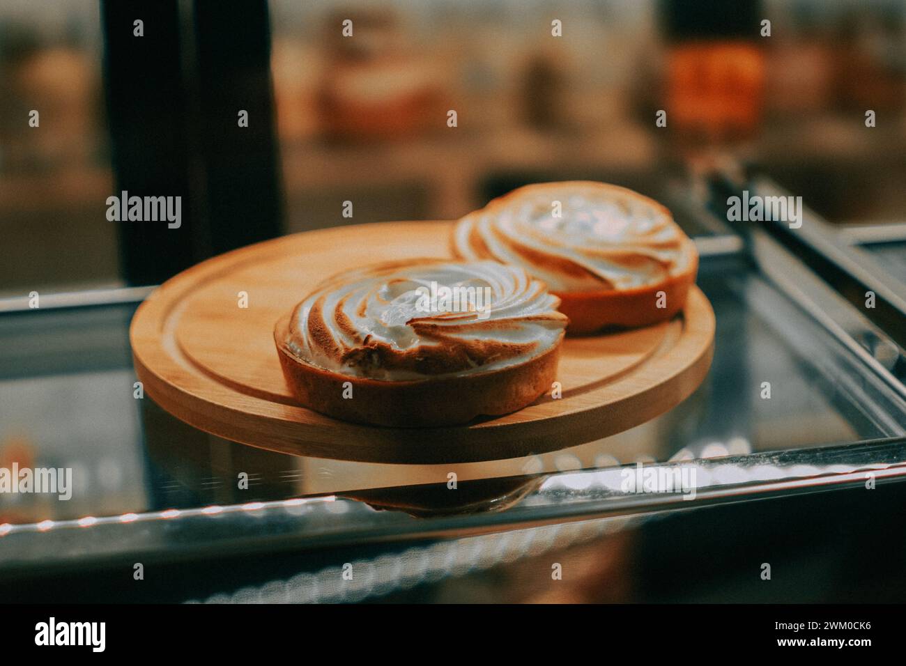 The delicious pastries in glass display case Stock Photo - Alamy