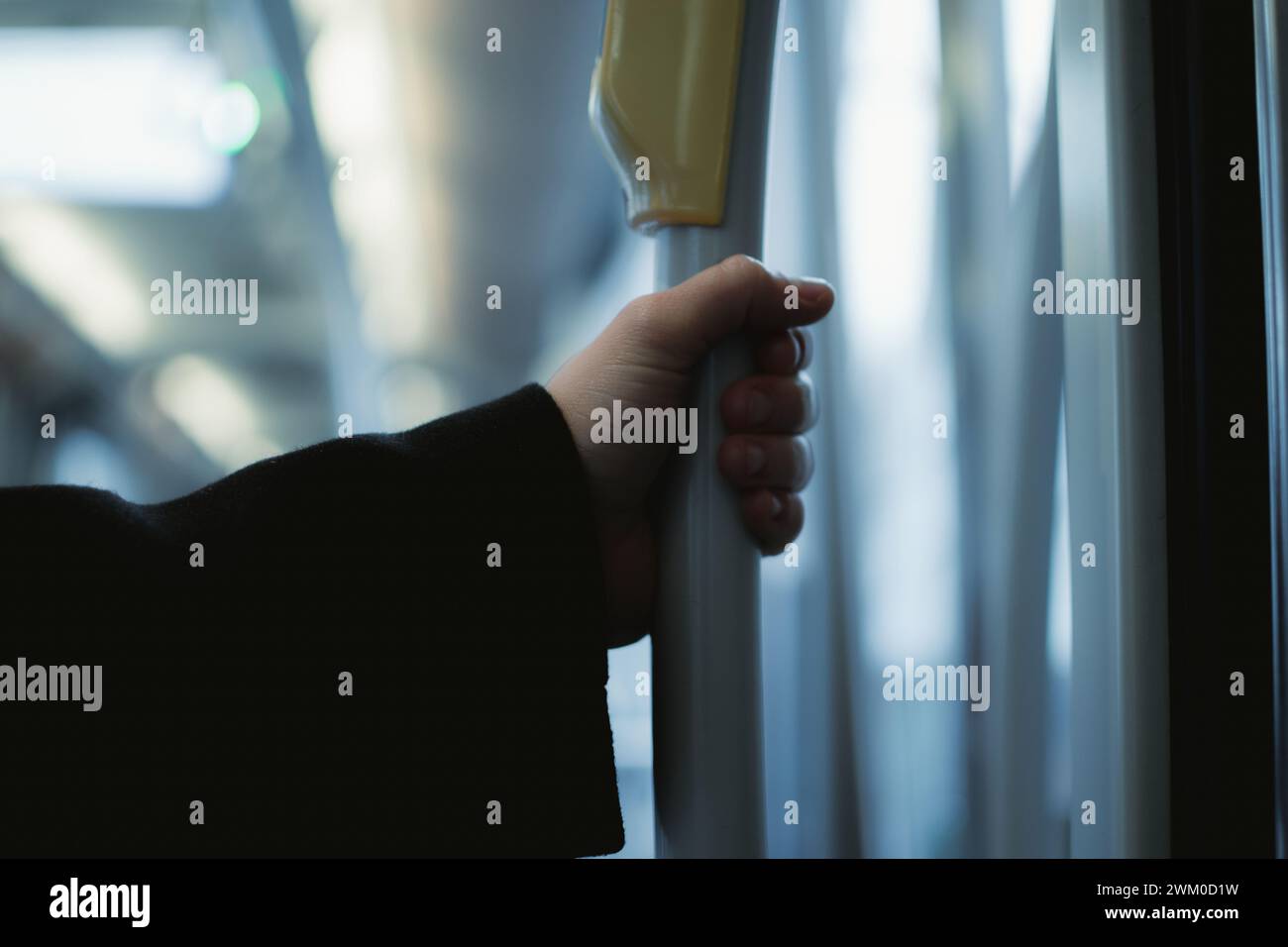 Hand reaching out of a door to grab object Stock Photo - Alamy