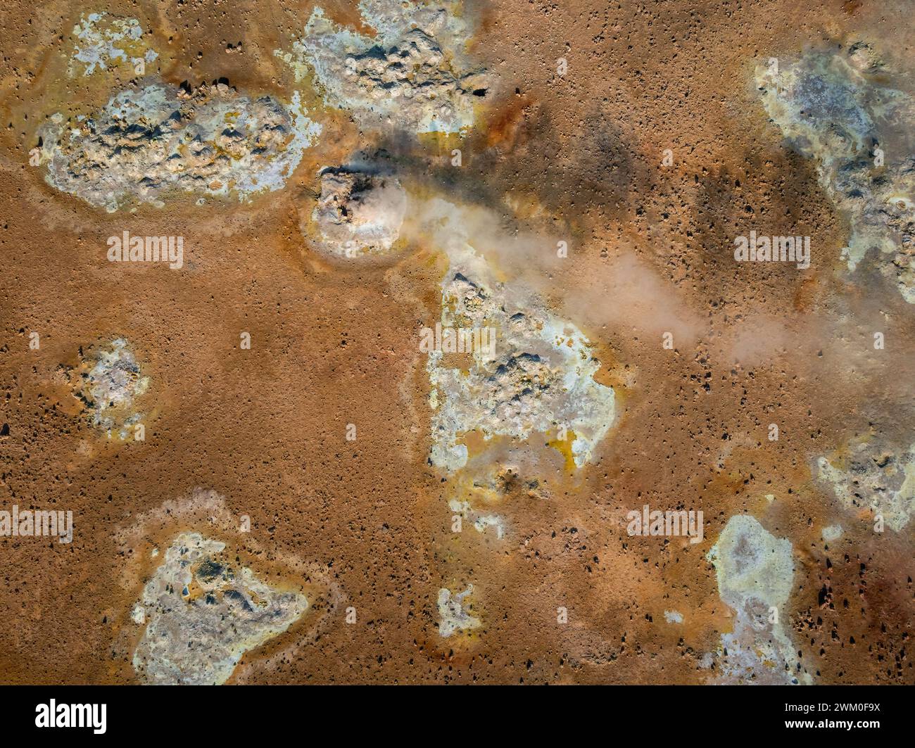 Gray hot bubbling mud pot in a volcano geothermal area, geological ...