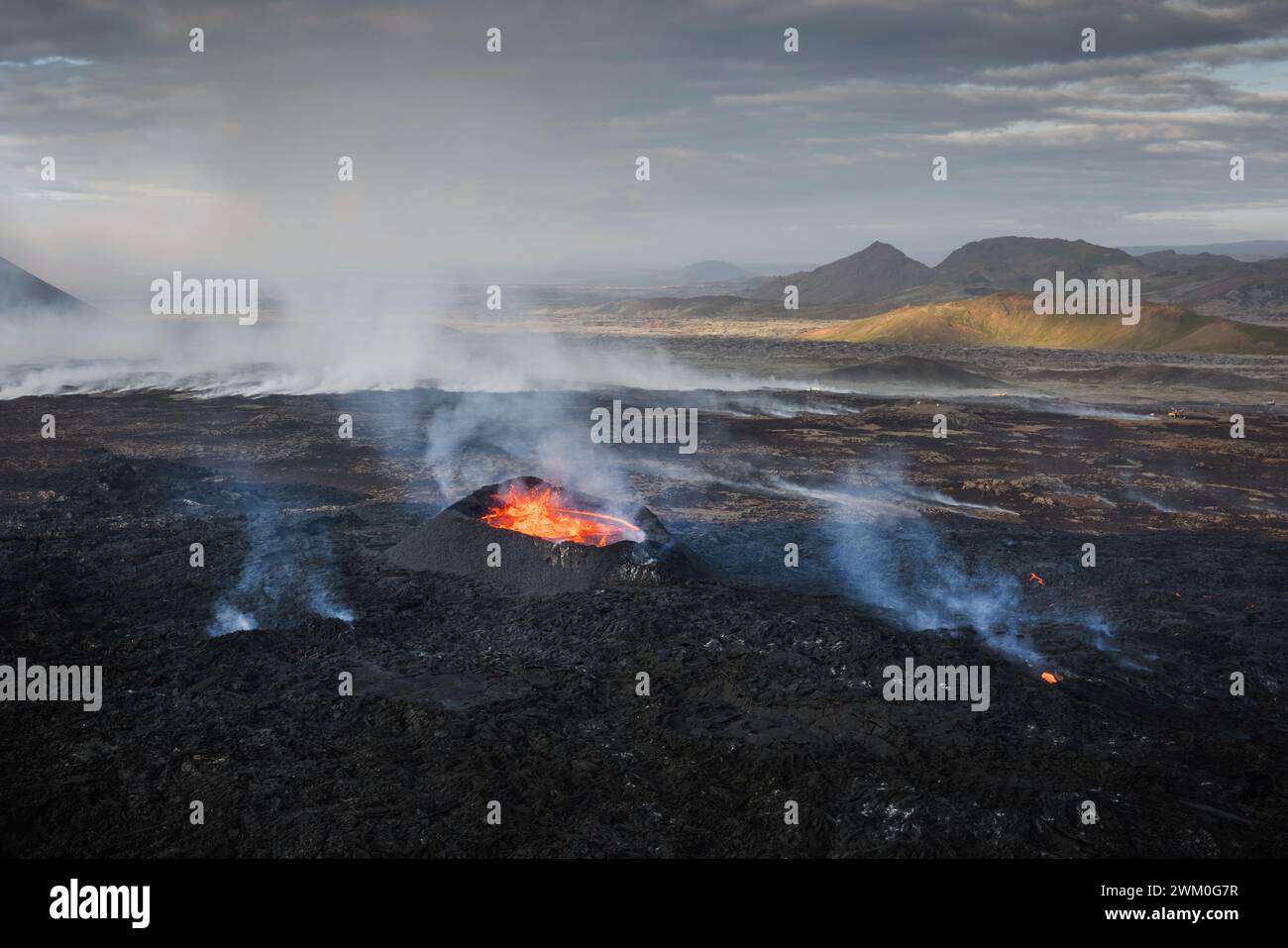 Apocalyptic surroundings of an erupted volcano, red hot lava boiling ...