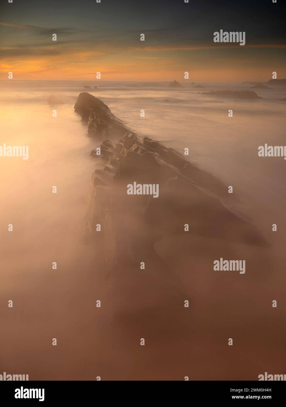 Portugal, Alentejo, Cavaleiro beach shrouded in thick fog at dusk Stock ...