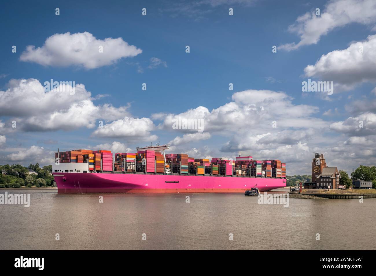 Germany, Hamburg, Pink container ship passing pilot station ...
