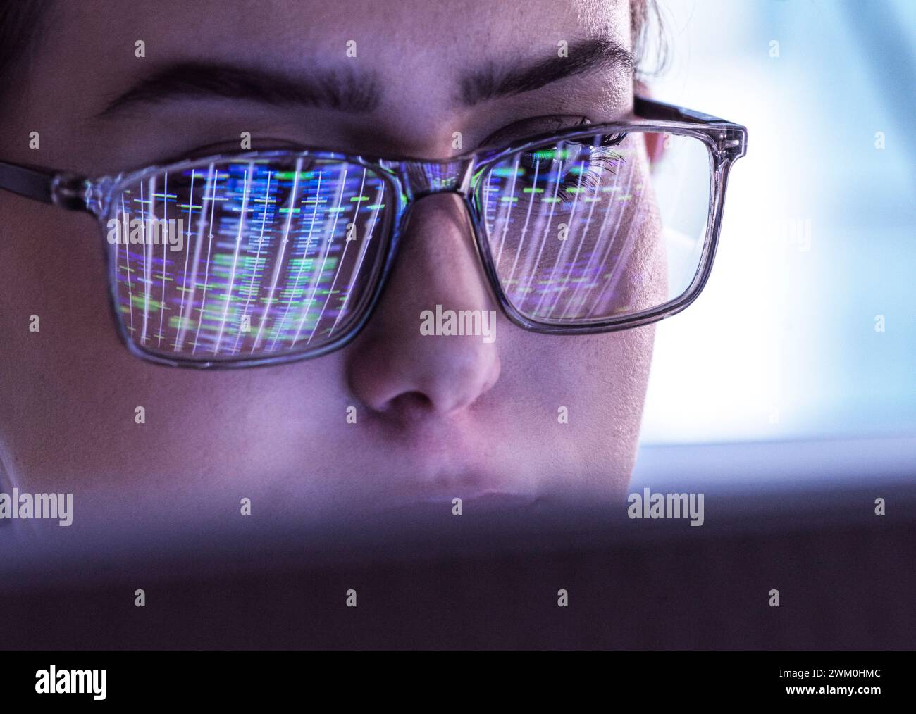 Scientist wearing eyeglasses and analyzing DNA data on computer Stock Photo - Alamy