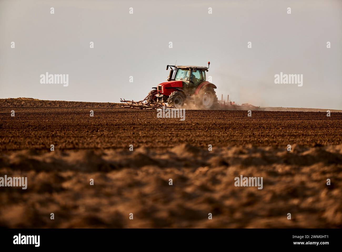 Tractor cultivating plowing agriculture hi-res stock photography and ...
