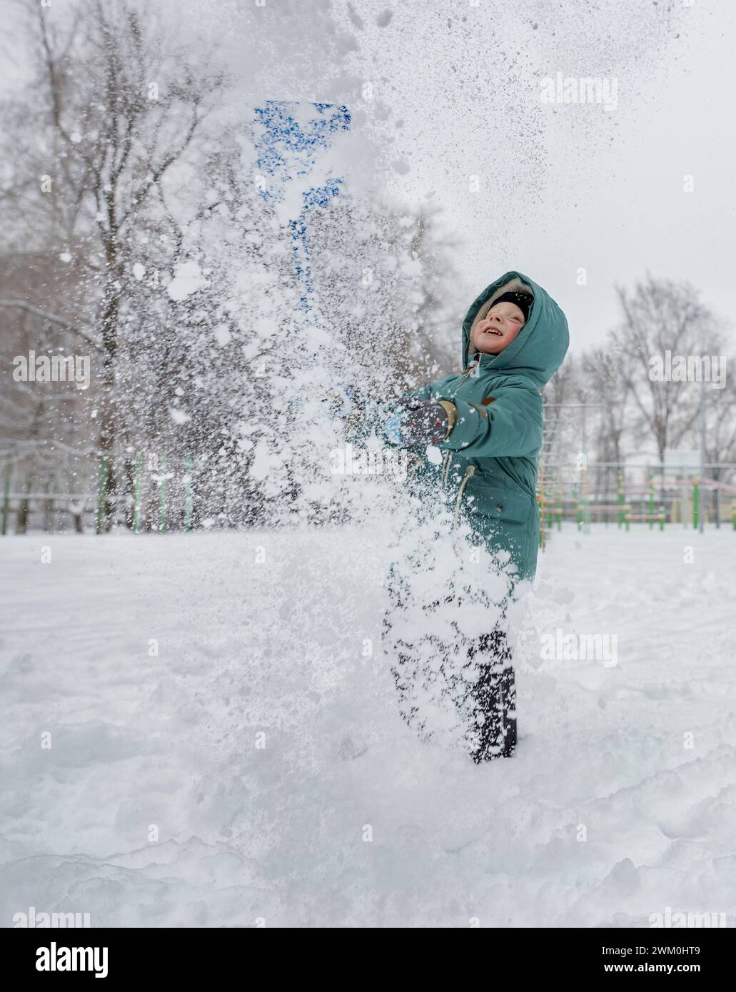 Boy throwing snow in air hi-res stock photography and images - Alamy