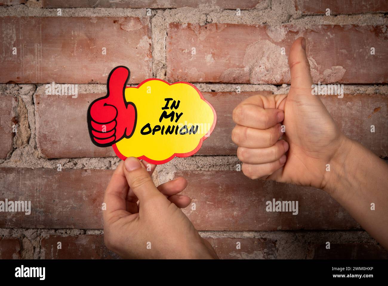In My Opinion. Sticky note with text on a red brick background Stock ...