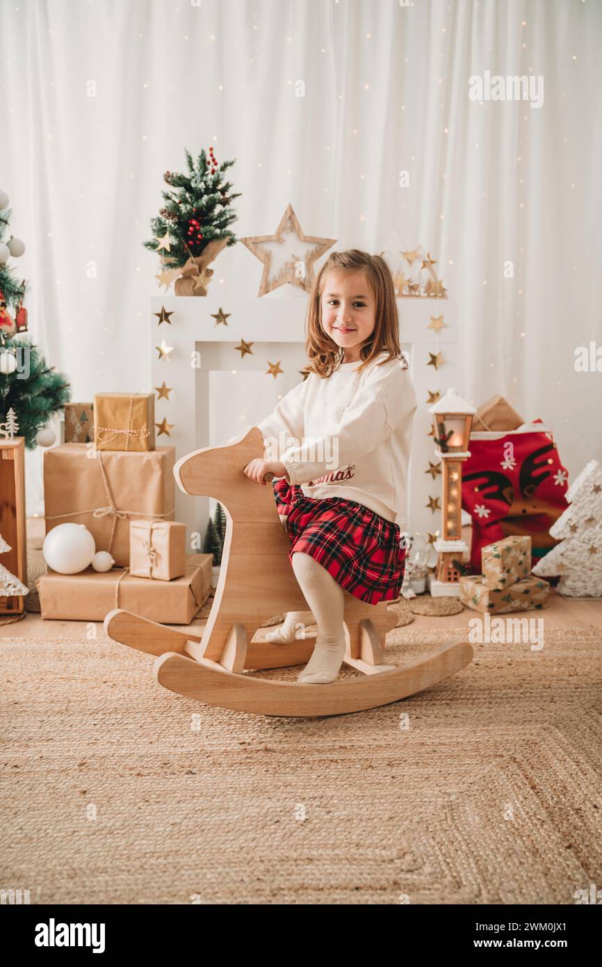 Girl on rocking horse hi-res stock photography and images - Alamy