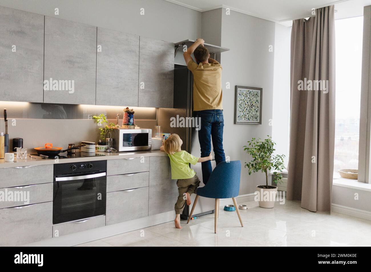 Opening kitchen cabinet door hi-res stock photography and images - Alamy