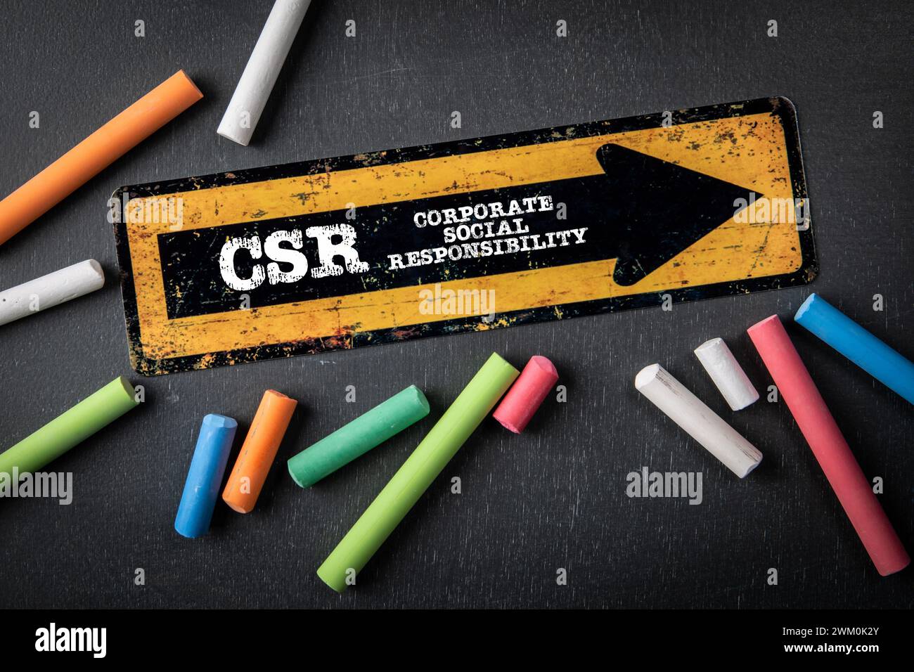 Corporate Social Responsibility. Direction arrow with text on a dark ...