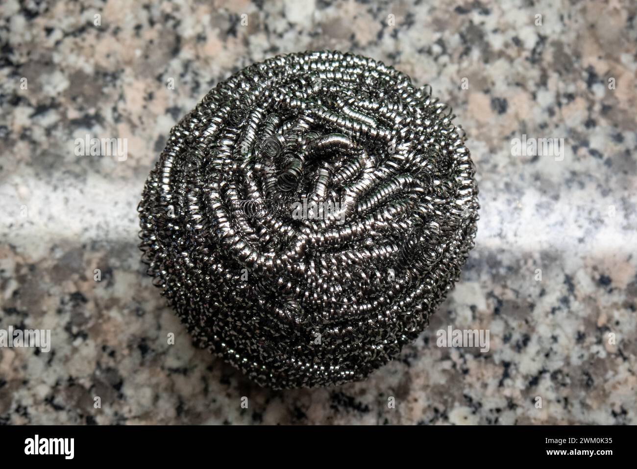 Kitchen wire cleaning or scrubbing sponge, on granite counter top Stock ...