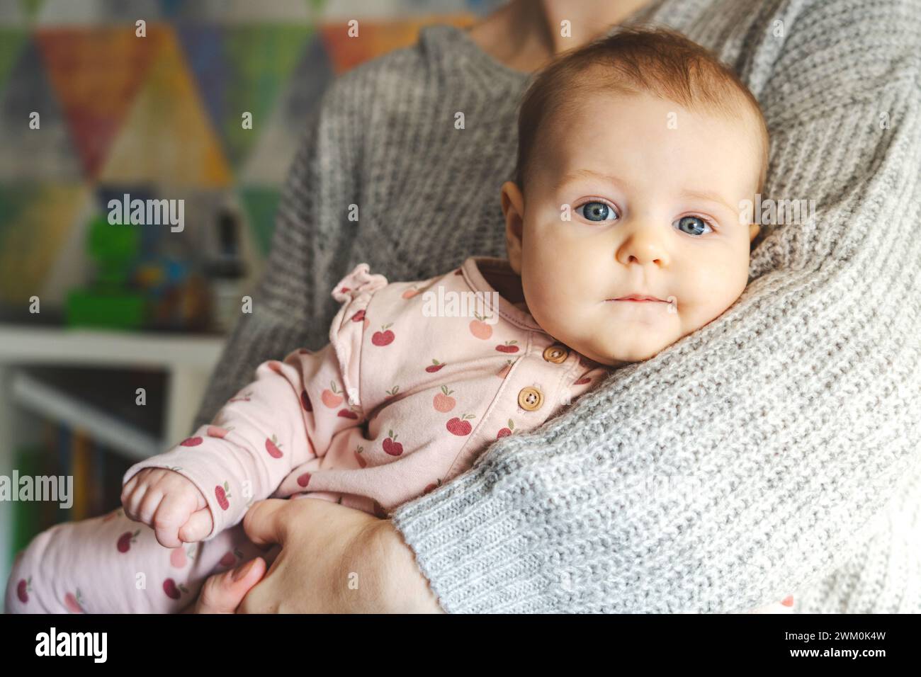 Baby holding on mothers hi-res stock photography and images - Alamy