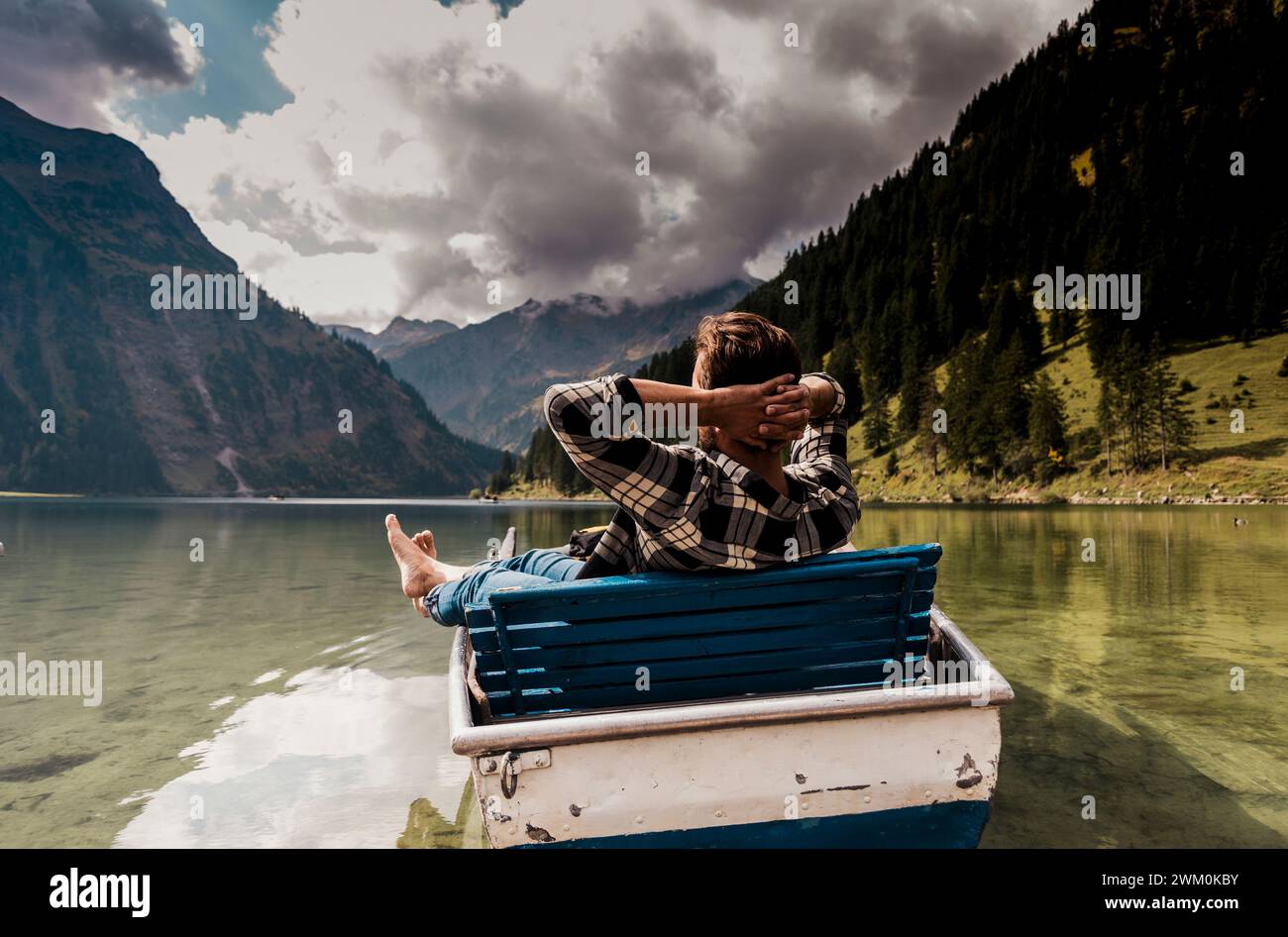 Man riding in a boat hi-res stock photography and images - Alamy