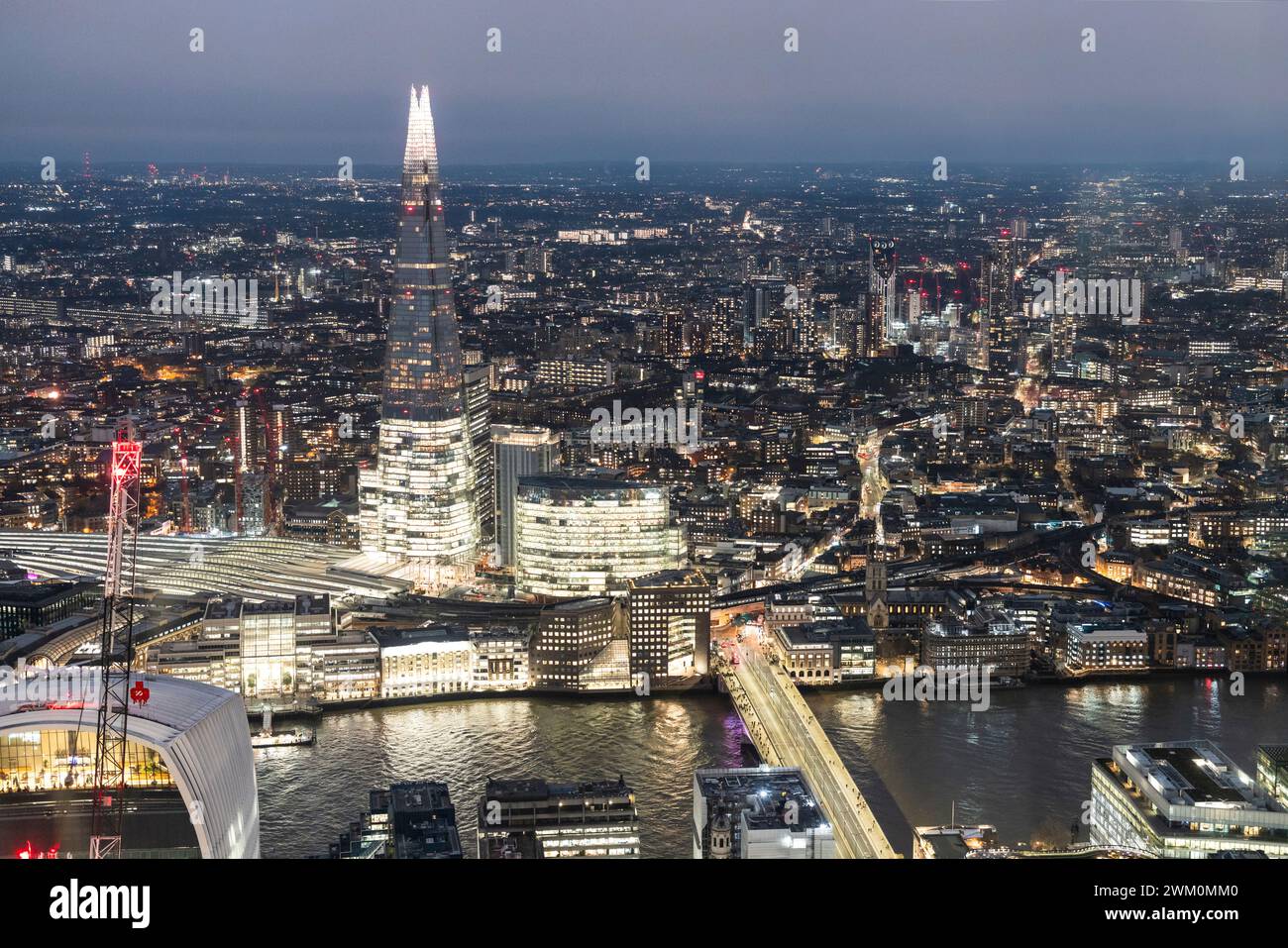 Illuminated Shard building near Thames river in London city Stock Photo ...