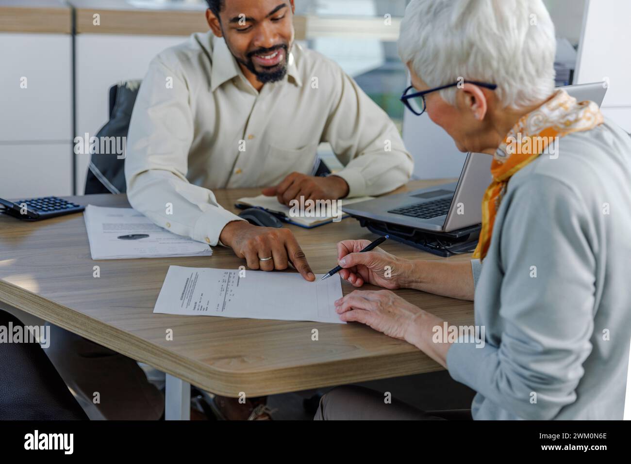 African man doing paperwork laptop hi-res stock photography and images ...